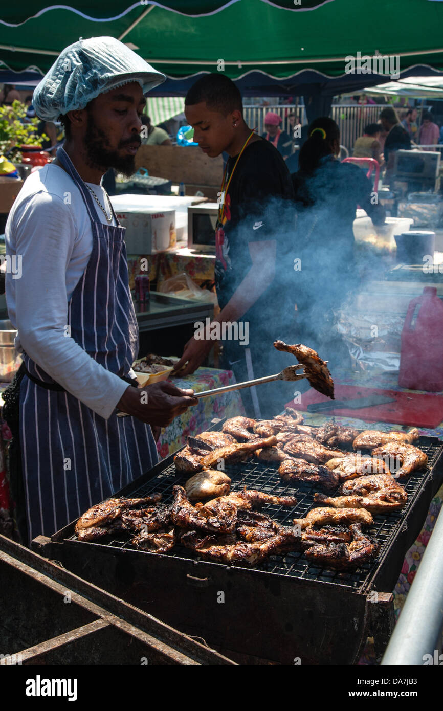 Bristol, UK. 6th July, 2013. Chicken on a BBQ at St Paul’s Carnival in ...