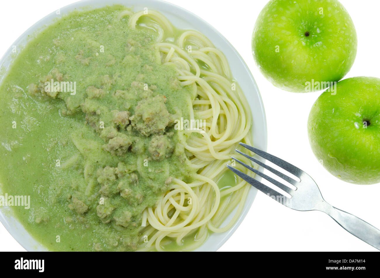 top view spaghetti with pork and green sauce , and fresh green apple ...