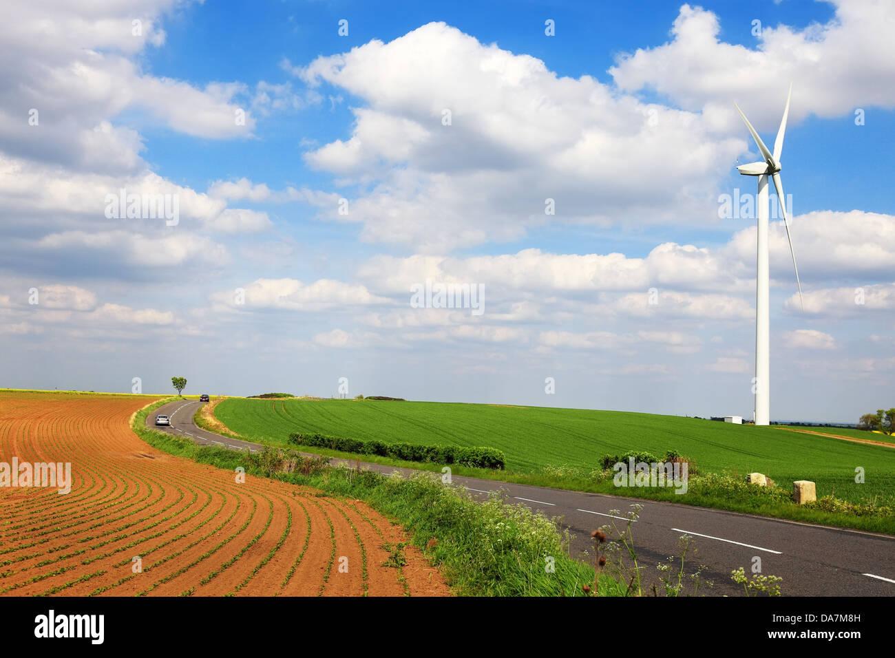 Wind turbine on spring field Stock Photo - Alamy