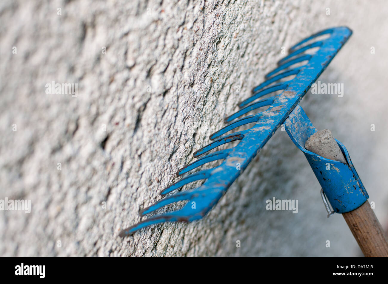 blue garden rake Stock Photo - Alamy