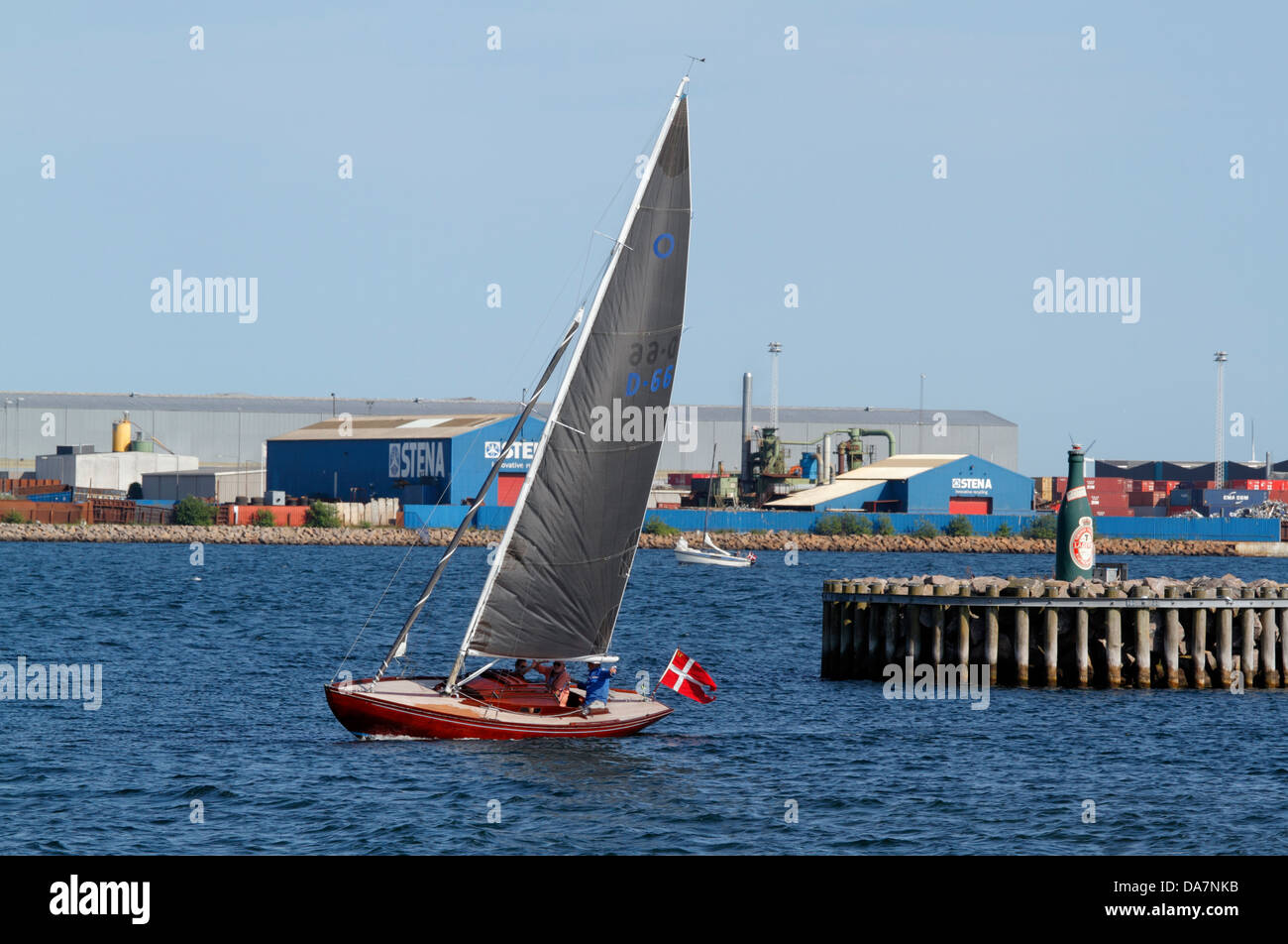 A sailboat of the Knarr class passing the port harbour light of Tuborg ...