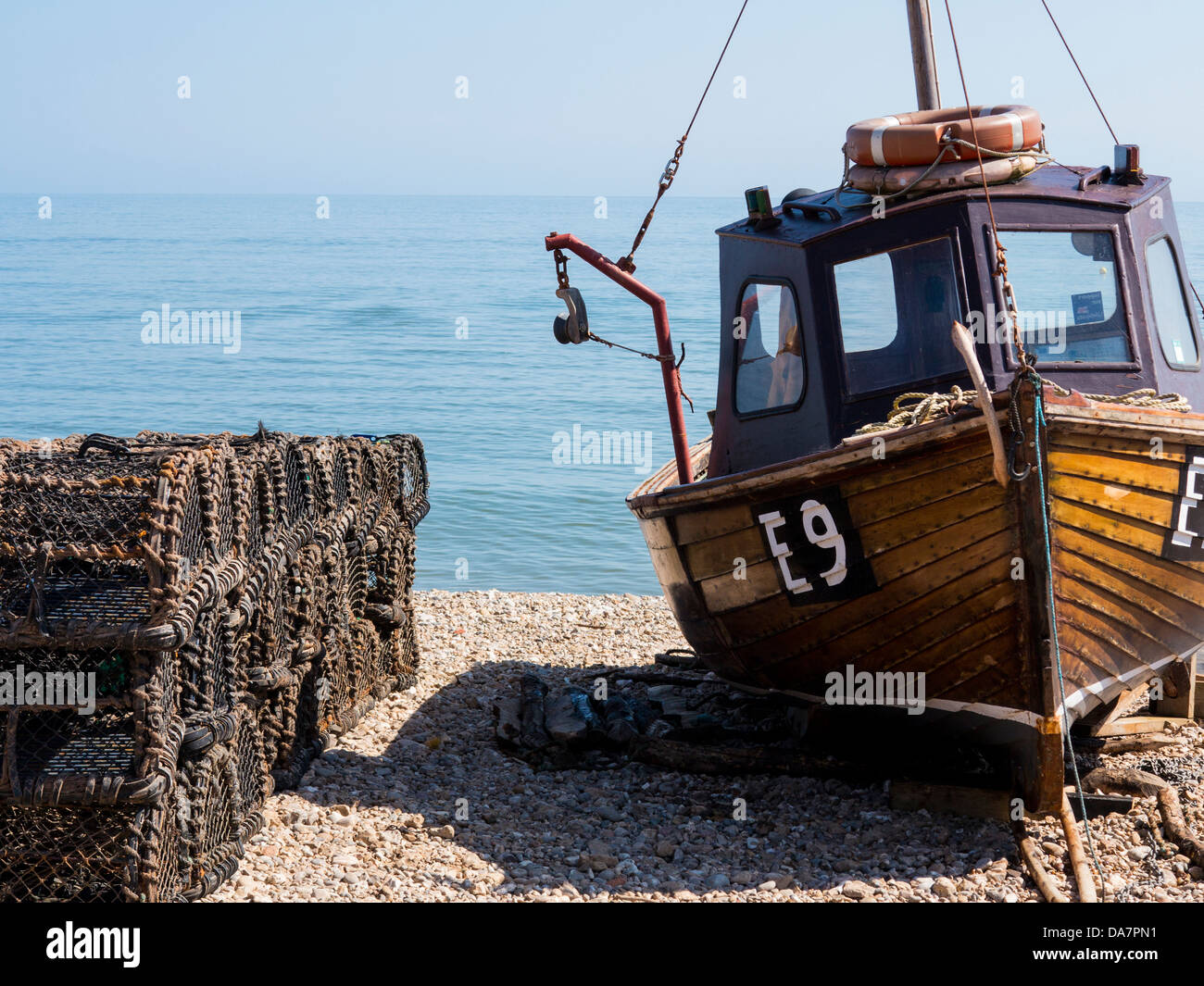 Fishing boat and lobster/ crab pots on the beach in Sidmouth, Devon ...