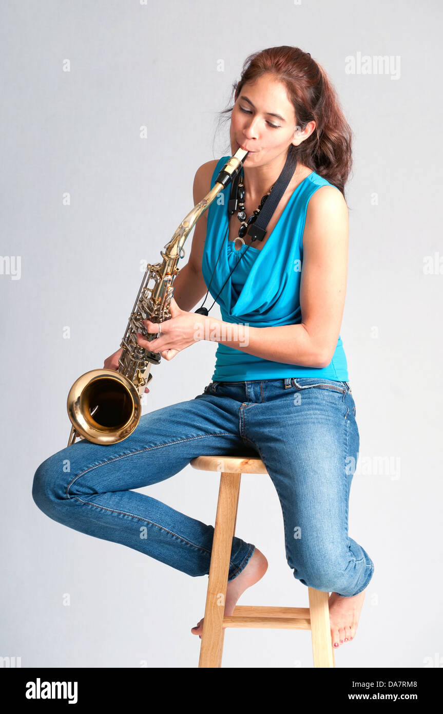Girl playing saxophone hi-res stock photography and images - Alamy