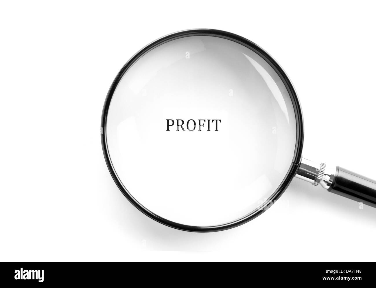 Magnifying glass showing the word profit on white paper Stock Photo - Alamy