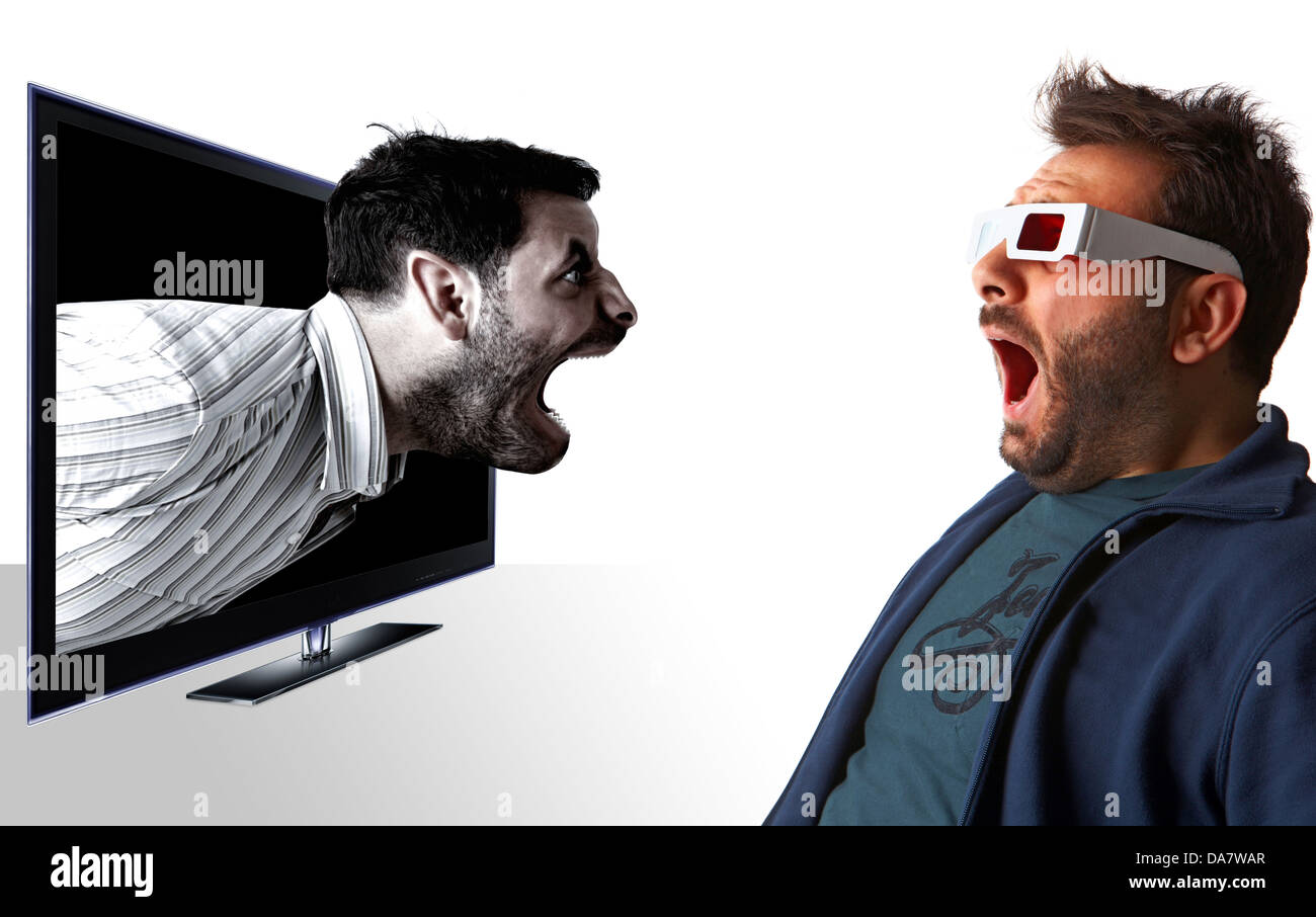 Man scared by a monster on television Stock Photo - Alamy