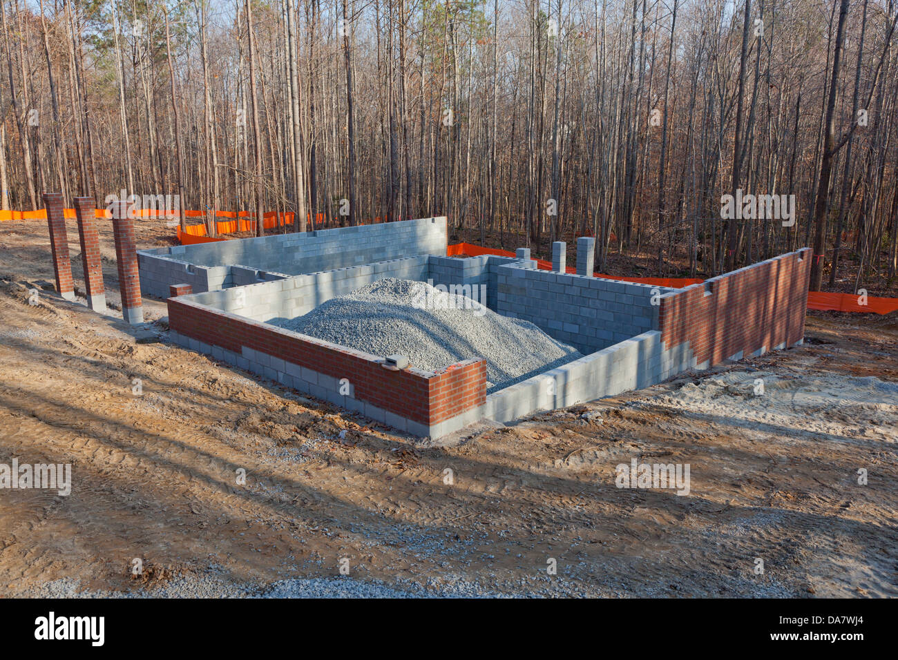New home being constructed with crawl space brick walls up and rocks ...