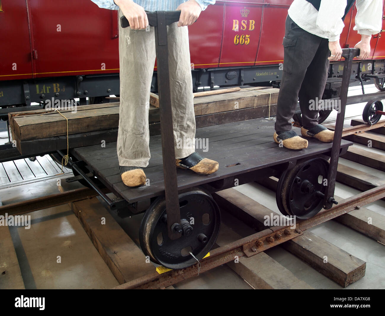 This image shows a Railway T-trolley, a type of small trolley used for ...