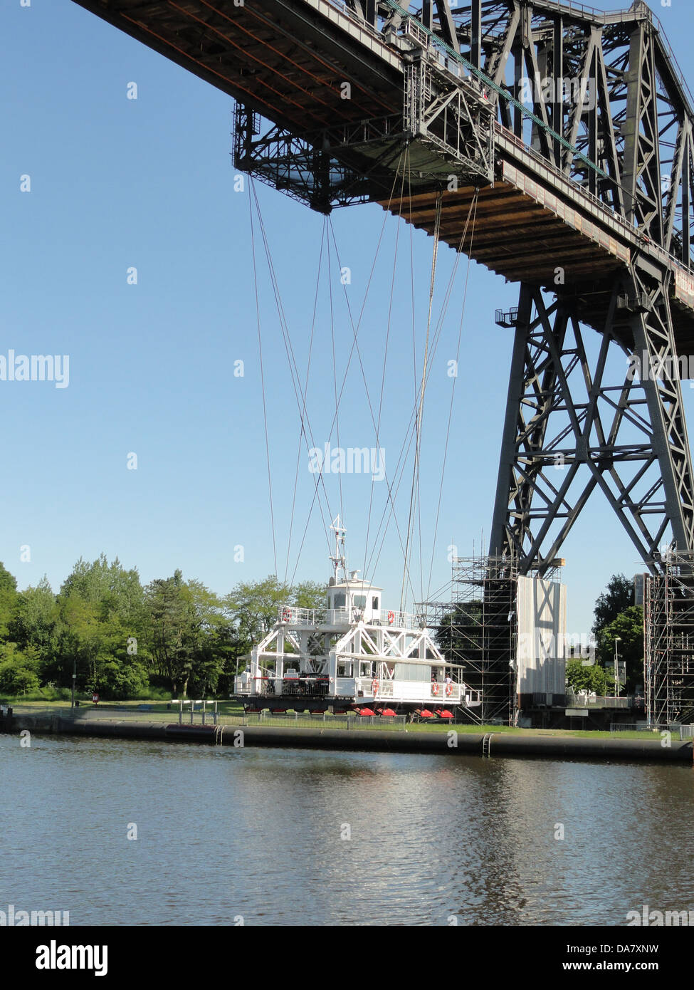 This image portrays the Rendsburg Suspension Bridge in Germany, a ...