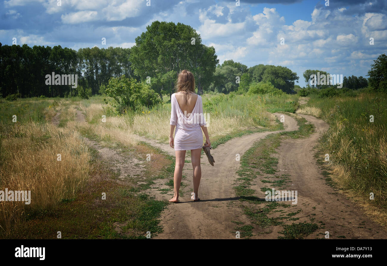 young woman on a crossroad Stock Photo - Alamy