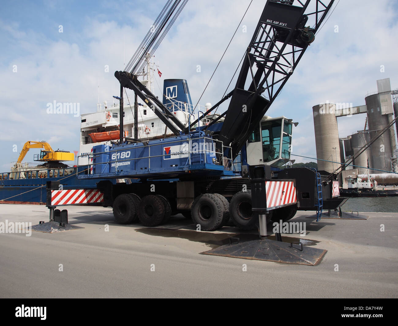 The Sennebogen 6180 harbor crane at Vejle Harbor is a large industrial ...