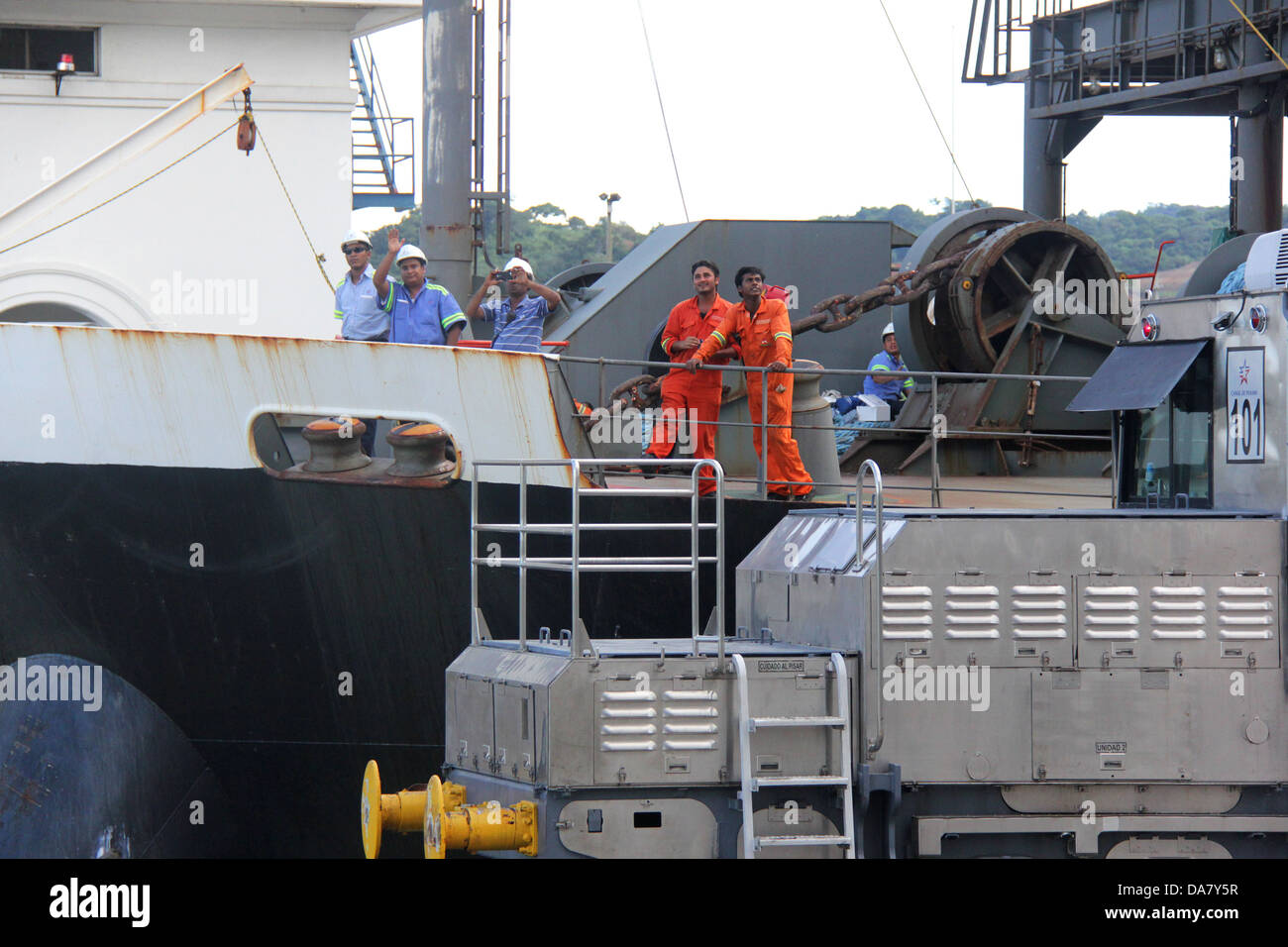 Merchant ship sailors and Panama Canal workers smiling as they transit ...