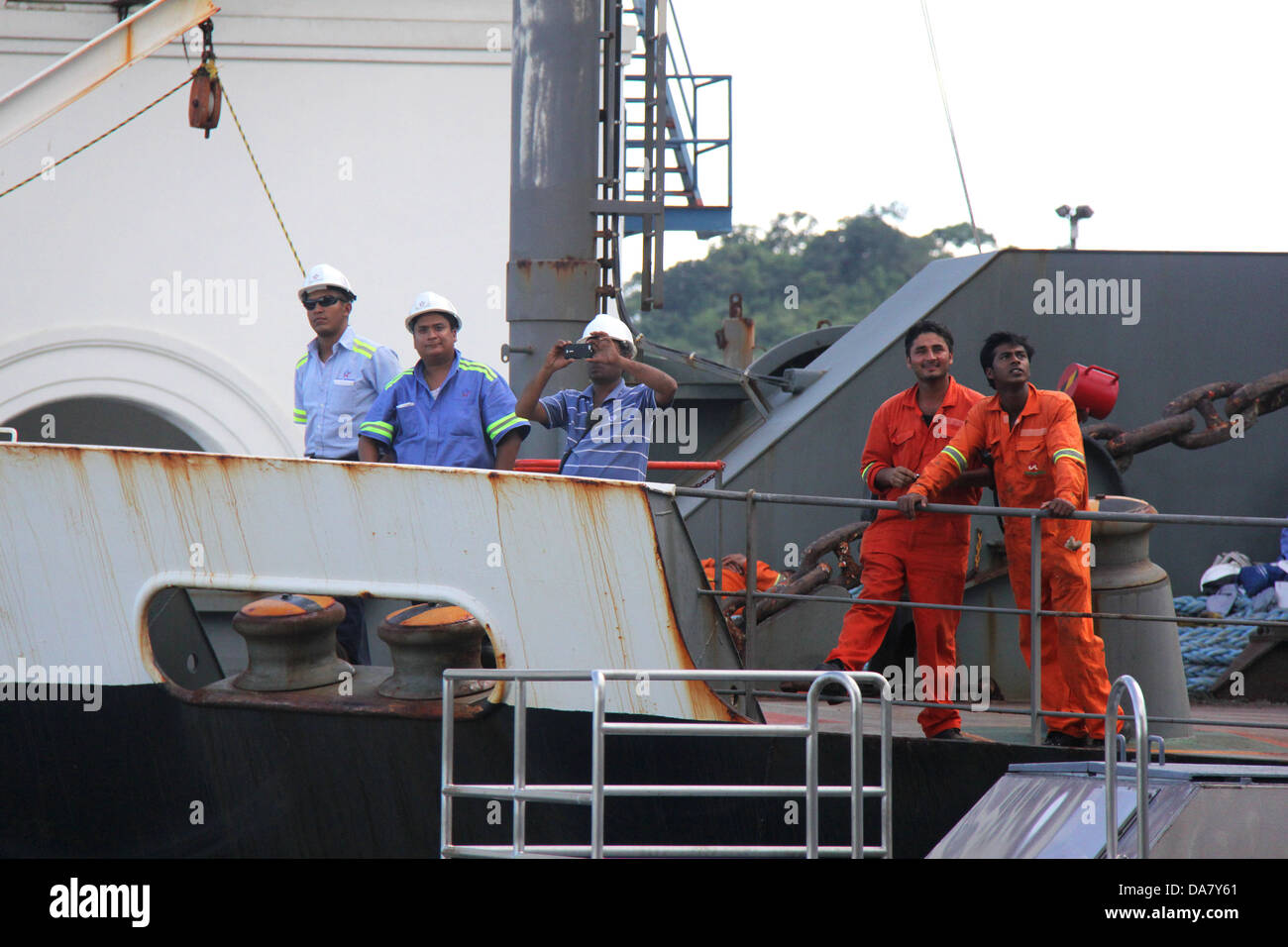 Merchant ship sailors and Panama Canal workers smiling as they transit ...