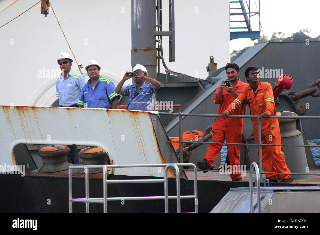 Merchant ship sailors and Panama Canal workers smiling as they transit ...