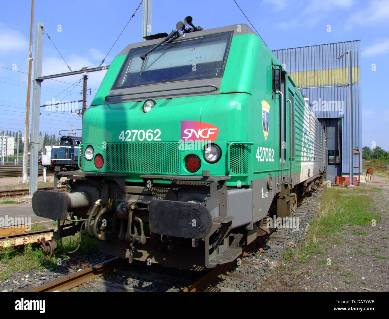 This image features a freight train, SNCF Fret 427062, operated by ...
