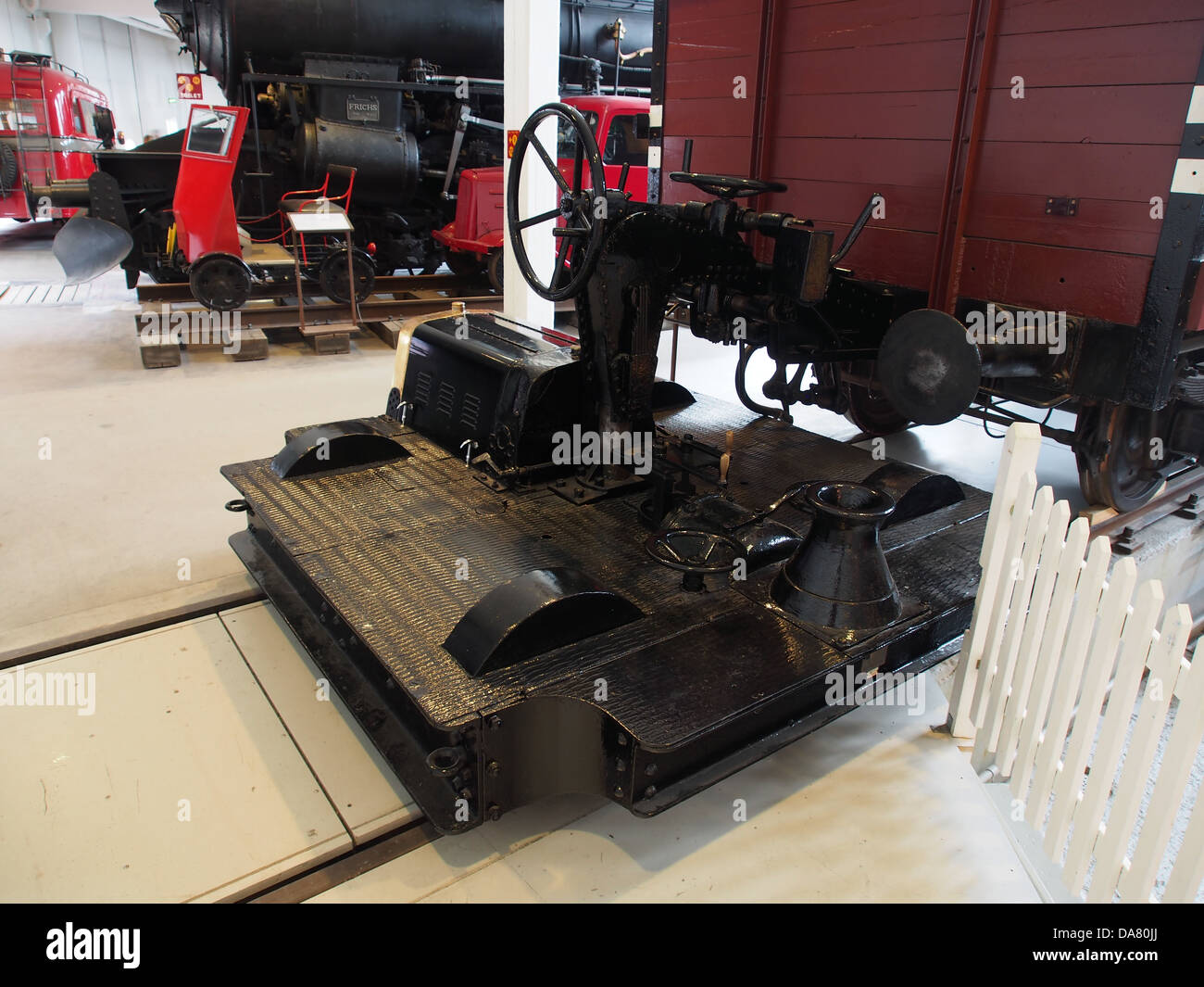 This image features a very old black shunter locomotive, a type of ...