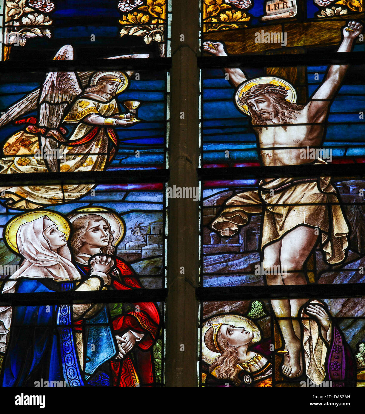 Stained Glass window depicting Jesus on the cross Stock Photo - Alamy