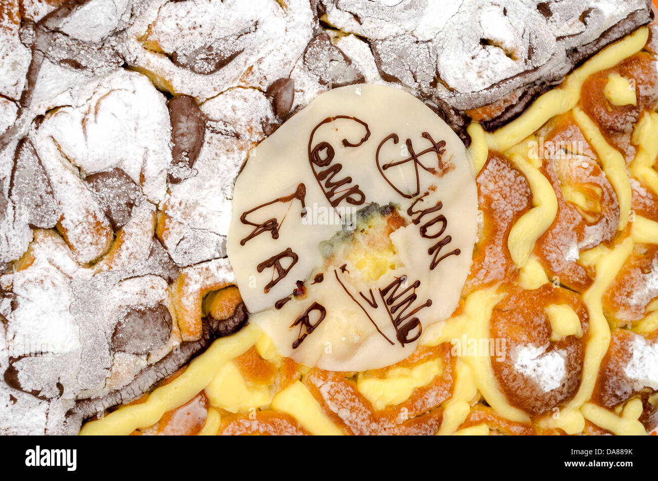 knife cuts a cake split in half with cream and sugar Stock Photo - Alamy