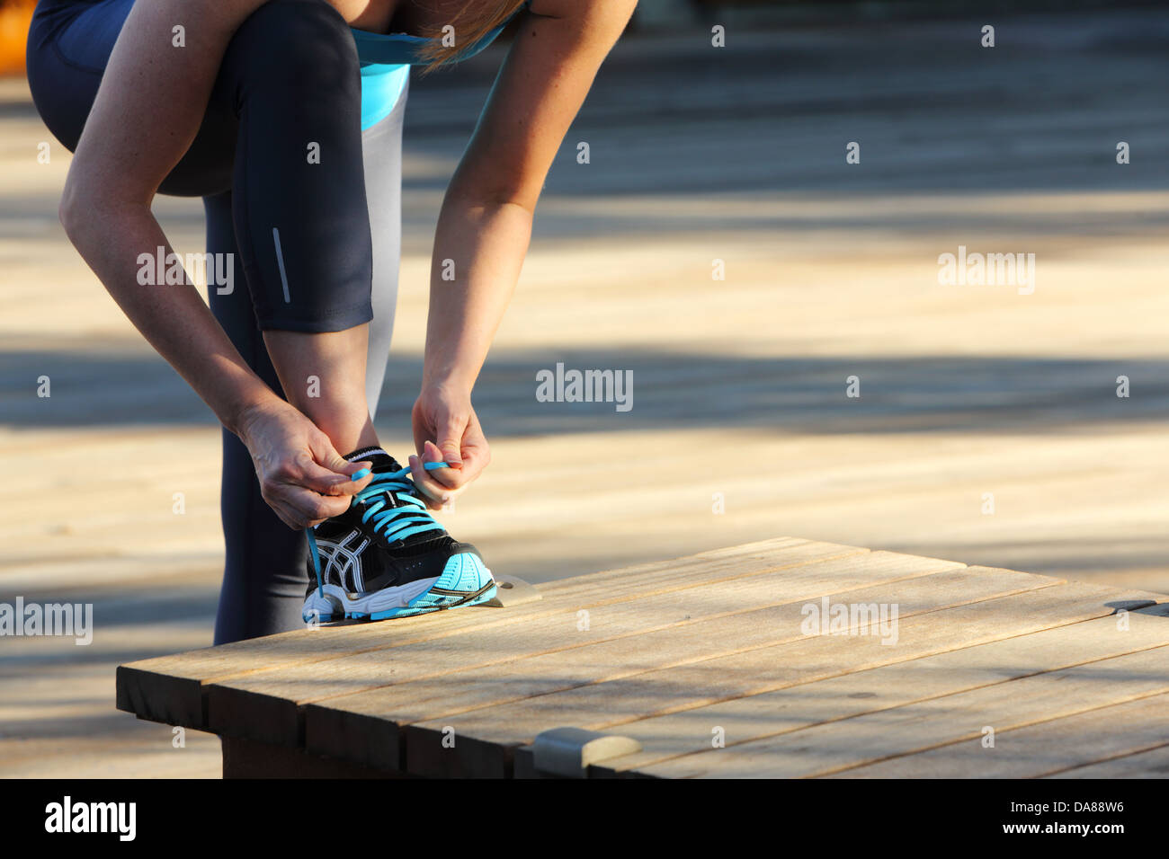 Runner Tying The Shoe Laces High Resolution Stock Photography and ...