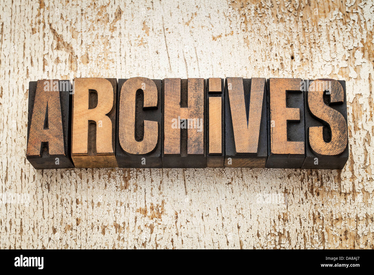 archives word in vintage letterpress wood type on a grunge painted barn ...