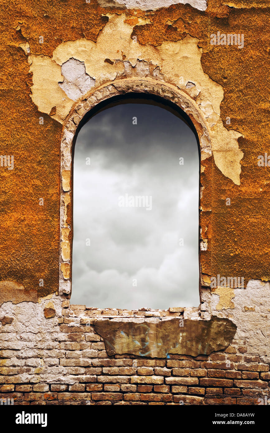 Dark clouds through an old obsolete window Stock Photo - Alamy