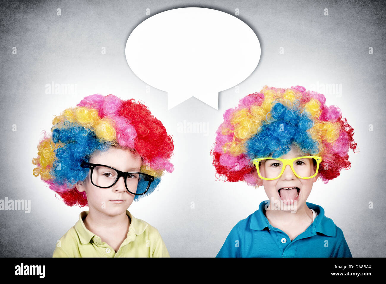 Happy and bored twins with the clown wig Stock Photo - Alamy