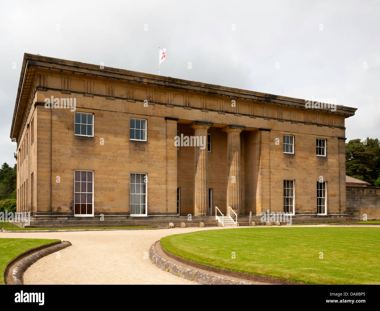 Belsay Hall front elevation across a neatly trimmed lawn Stock Photo ...
