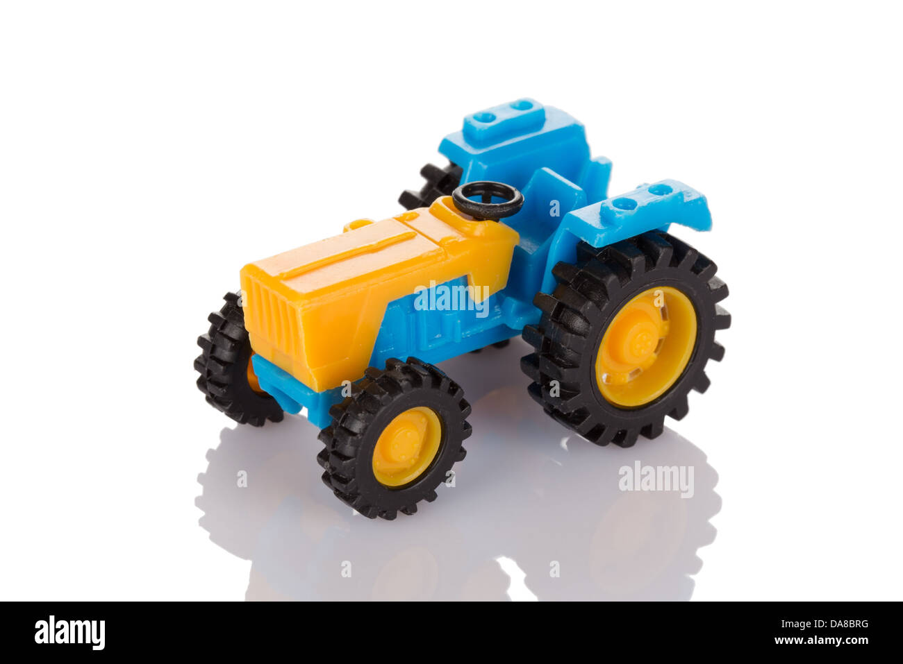 Small plastic tractor toy isolated on white background close up Stock ...