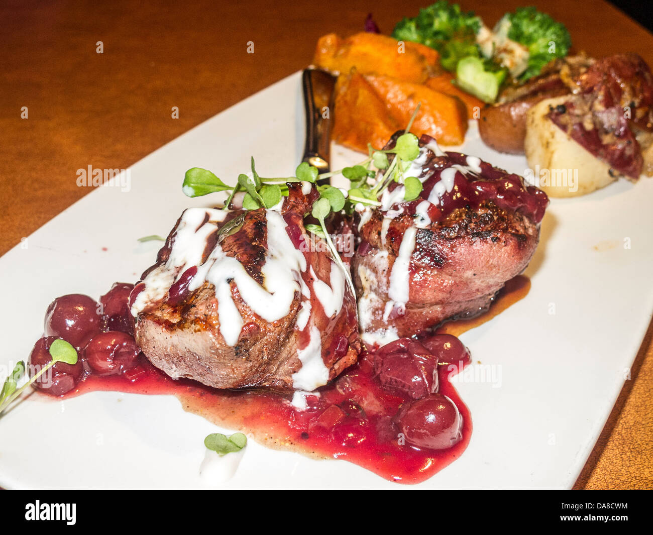 Bacon wrapped bison filet with creamy roqufort cheese sauce and ...