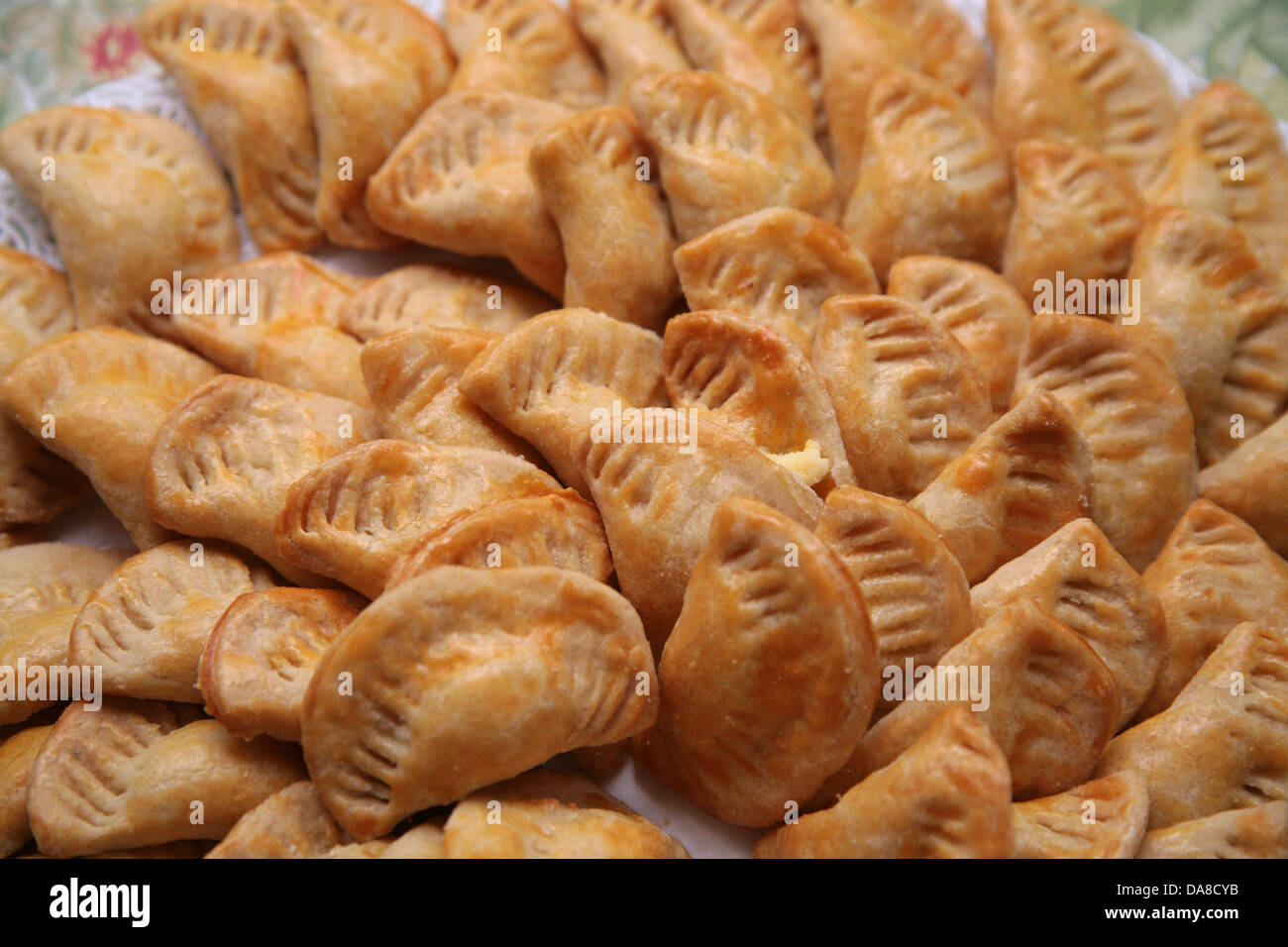 Empanadas served in a catering food service tray Stock Photo - Alamy