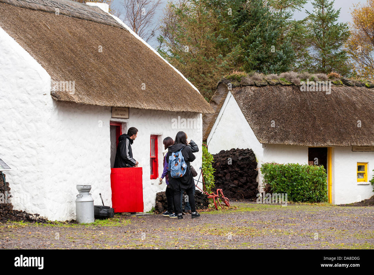 Visitors look at a laborers cottage at the Kerry Bog Village in Co ...