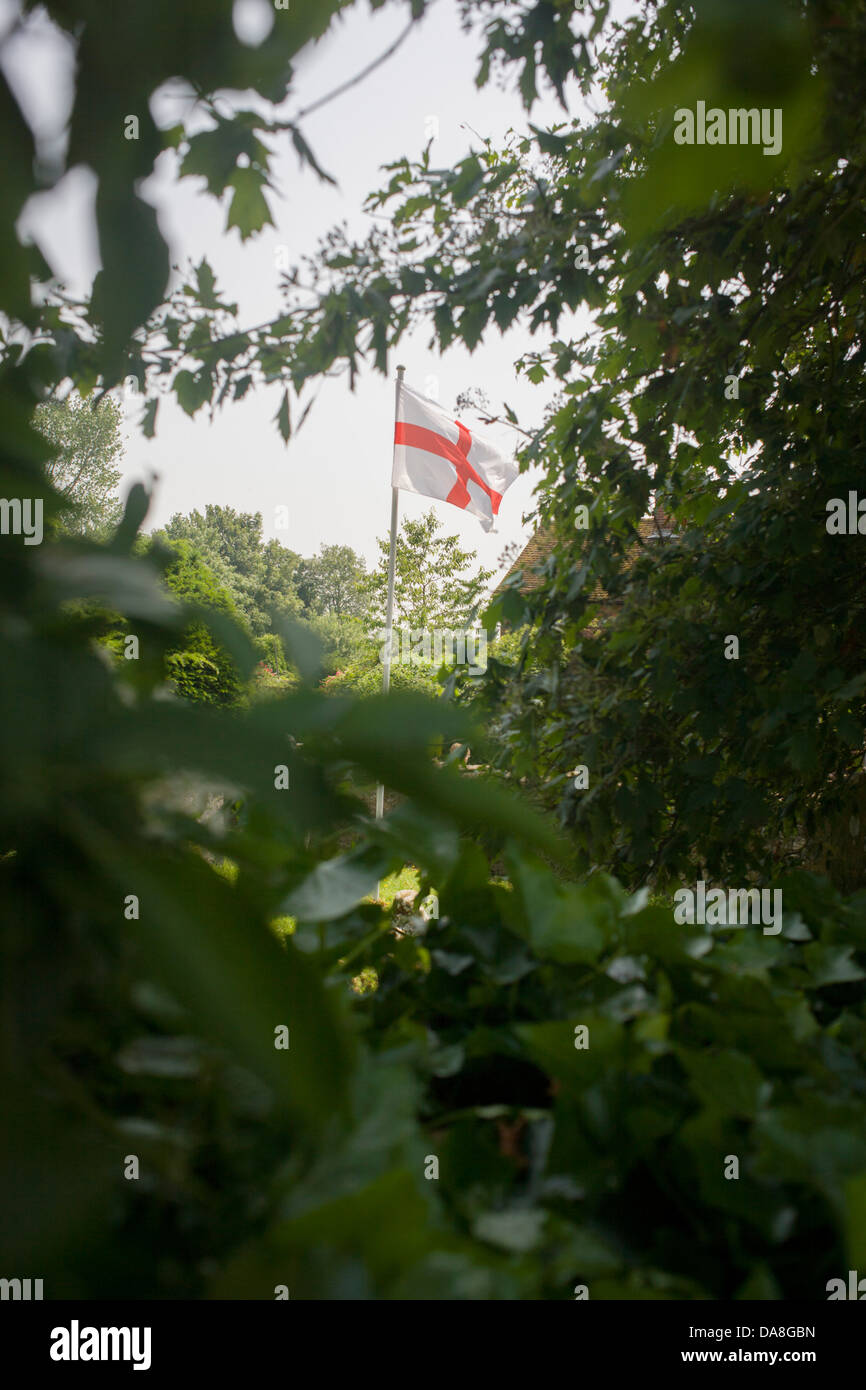 The English flag flies in the churchyard of St Dunstan church, West ...