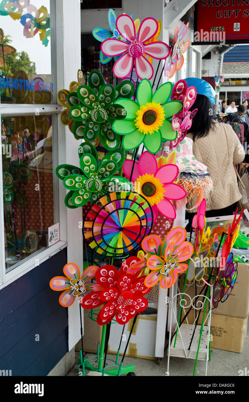 Bright and colourful flower pinwheels on display outside a tourist shop ...
