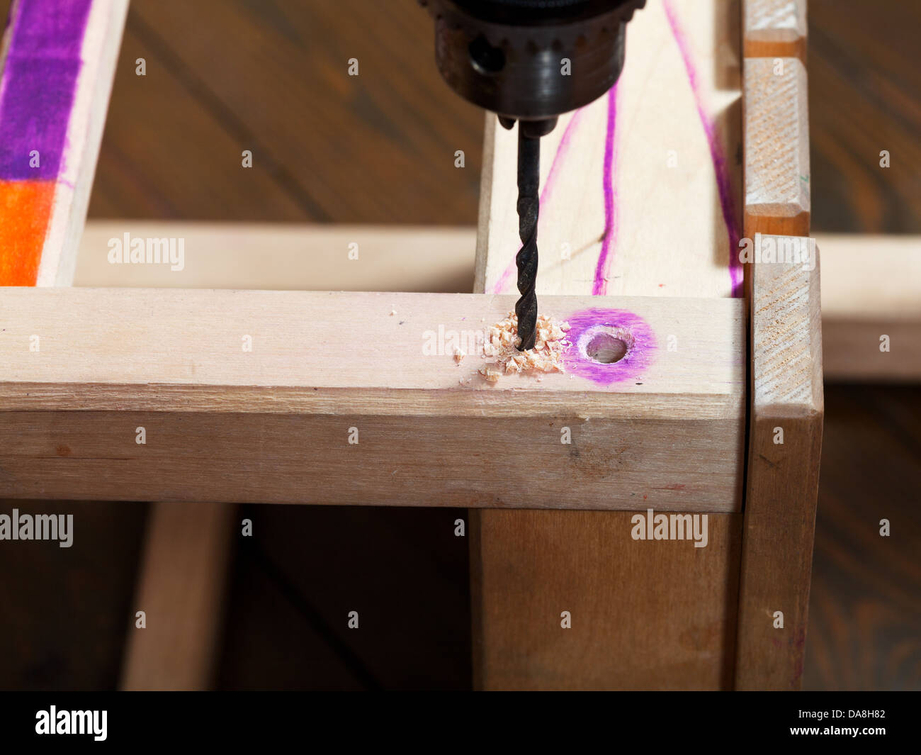 repairing of wooden chair with drill Stock Photo - Alamy