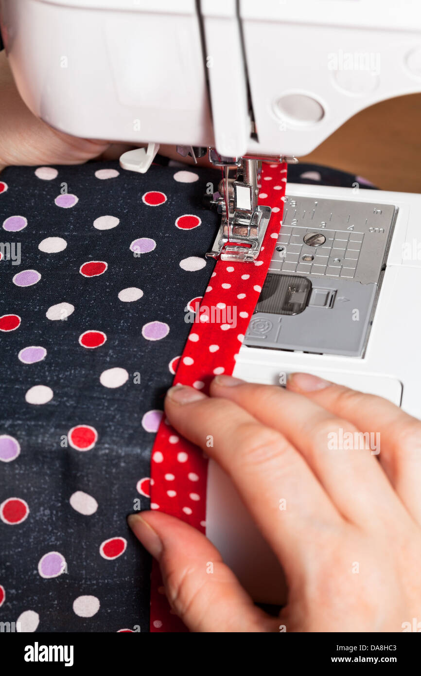 Sewer sews clothes on sewing hi-res stock photography and images - Alamy