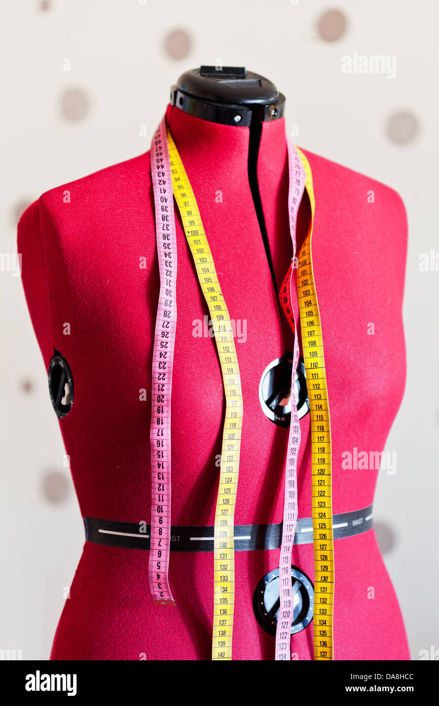 tailors dummy bust with two measure tapes Stock Photo - Alamy