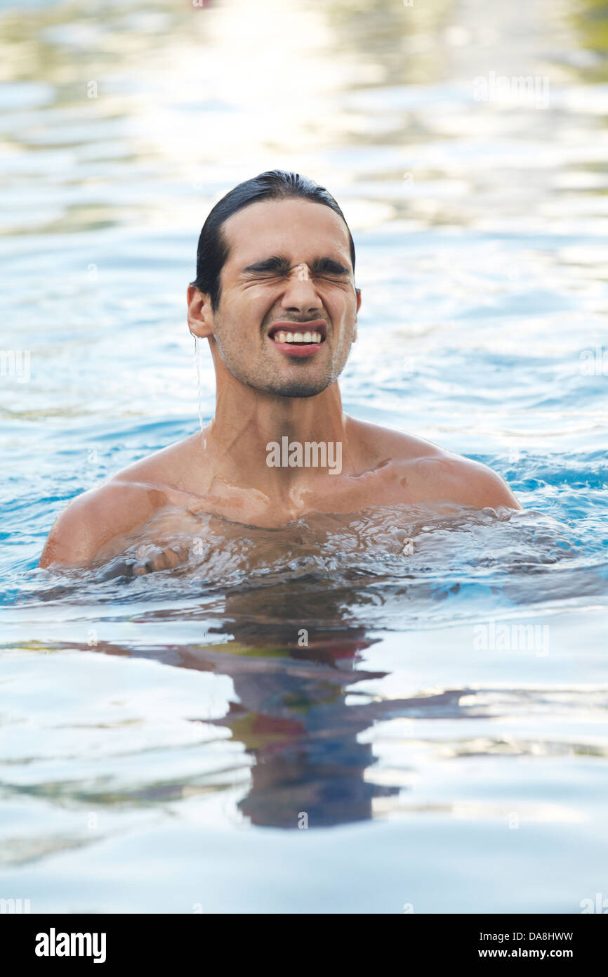 A man relaxing poolside Stock Photo - Alamy