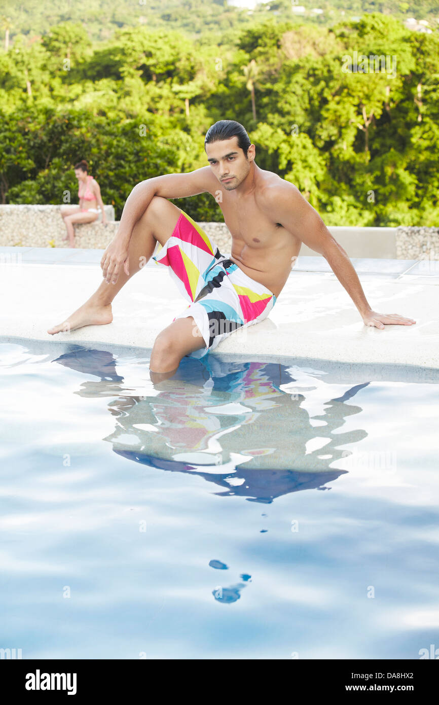A man relaxing poolside Stock Photo - Alamy