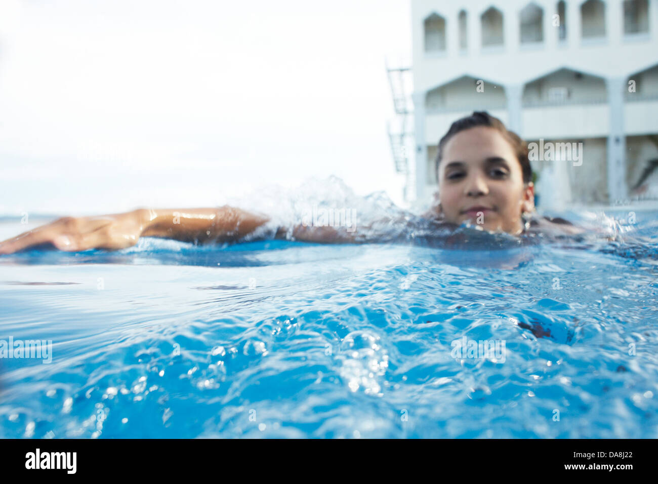 Friends playing in a swimming pool Stock Photo - Alamy