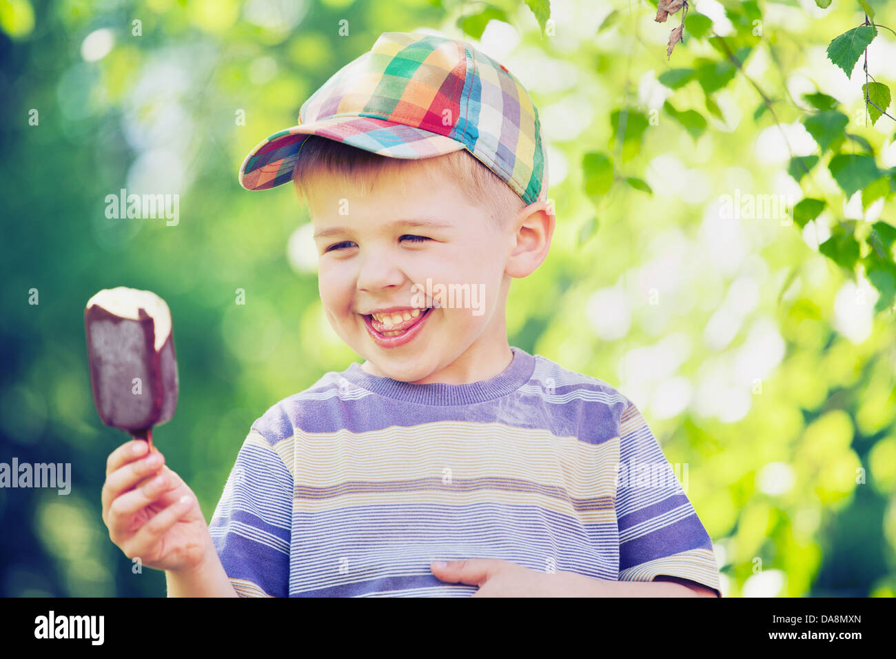 Cute little boy staring at an ice cream Stock Photo - Alamy
