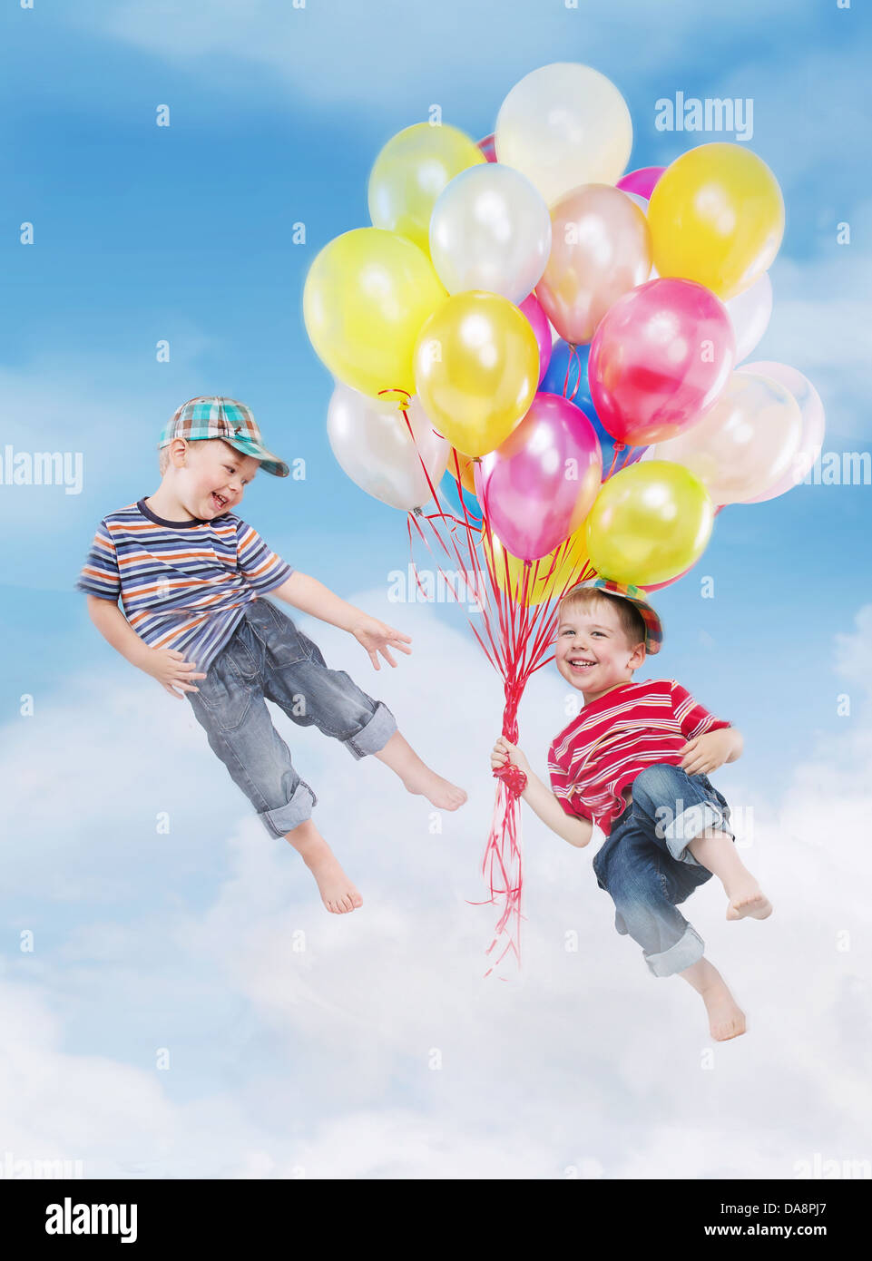 Smiling children flying with balloons Stock Photo - Alamy