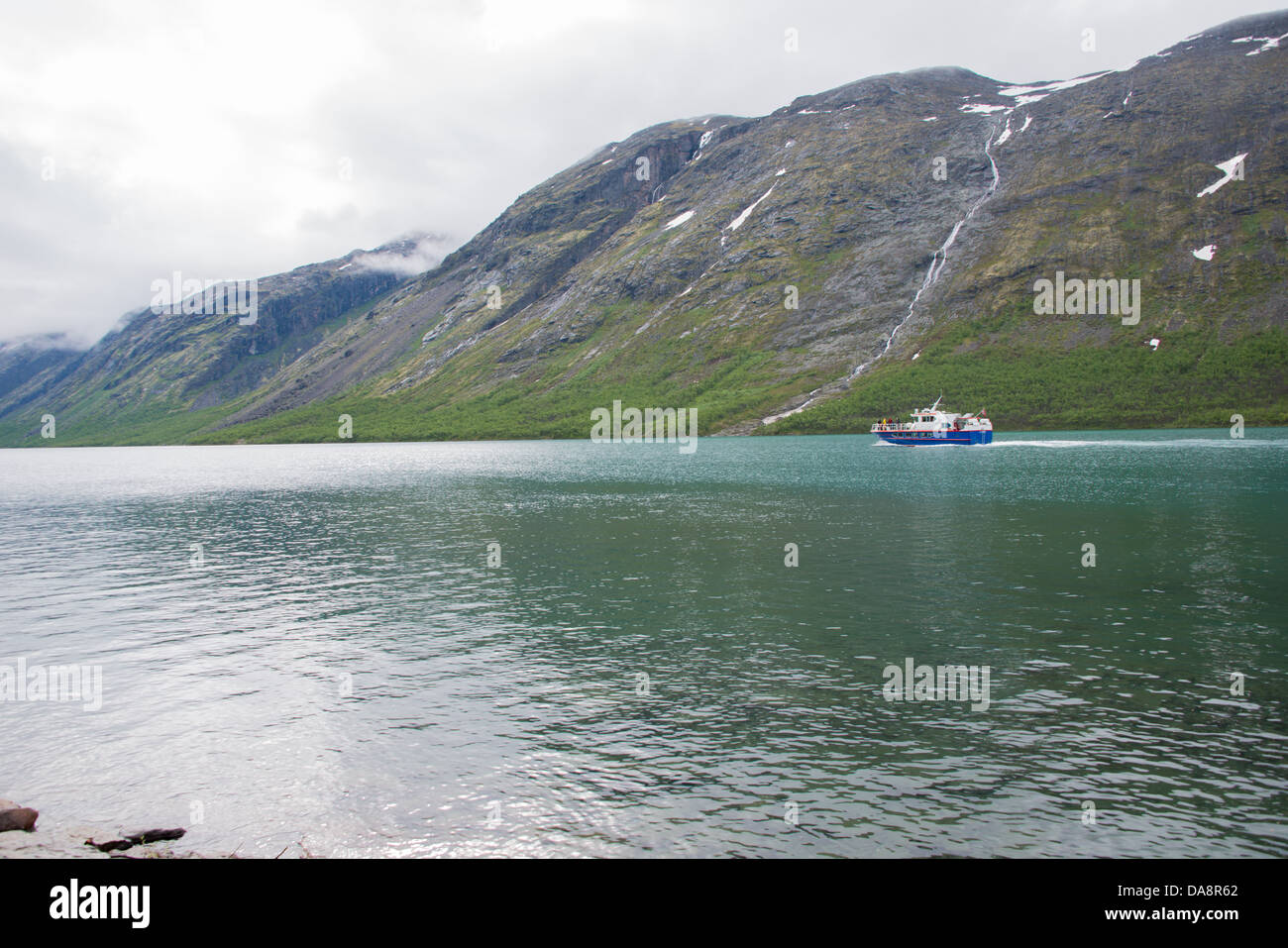 The Gjende transport boat on the Gjende lake in Jotunheimen leaving ...