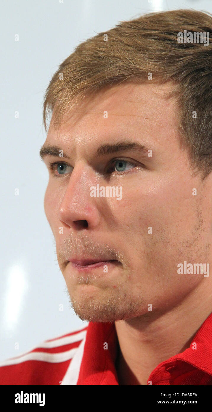 Holger Badstuber of FC Bayern Munich stands at a press conference in ...