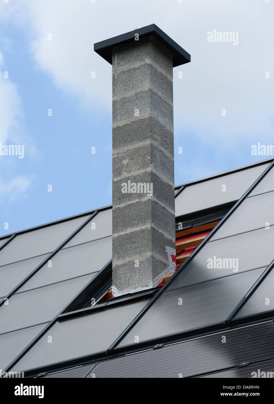 Sun collectors surround the chimney of an energy independent house in ...