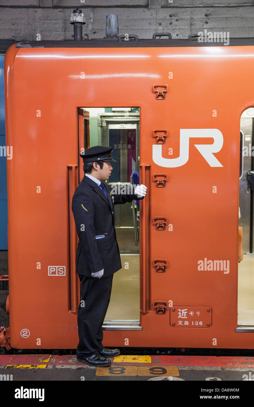 Japan, Honshu, Kansai, Osaka, Train Guard Checking Watch Stock Photo ...