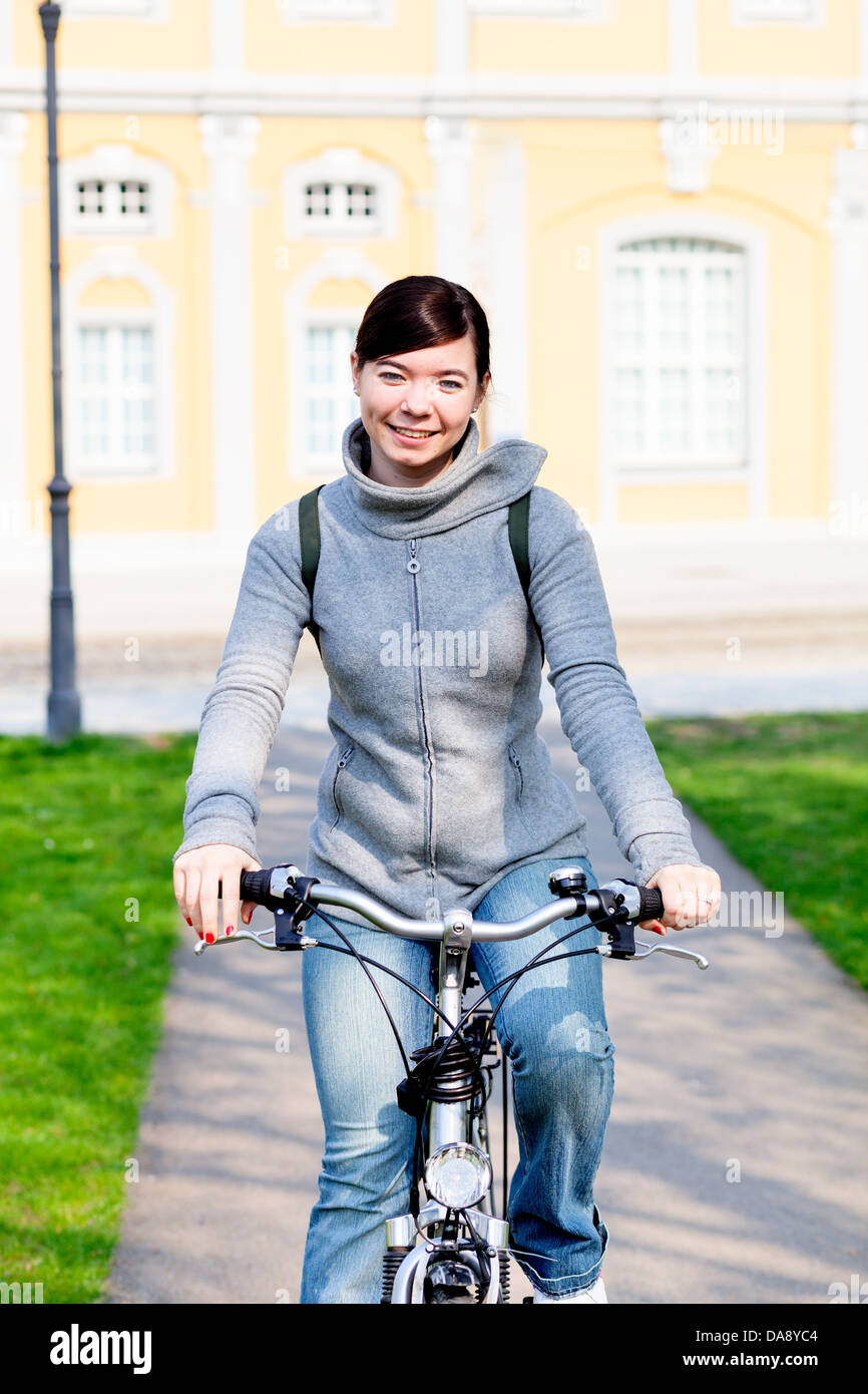 Cyclist Teen on a bike in summer city park Stock Photo - Alamy