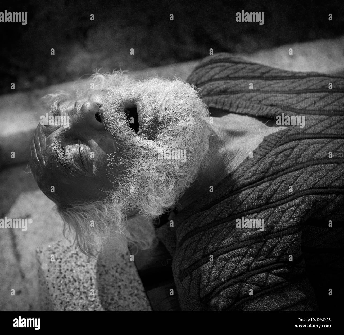 real homeless man sleeping on the street Stock Photo - Alamy