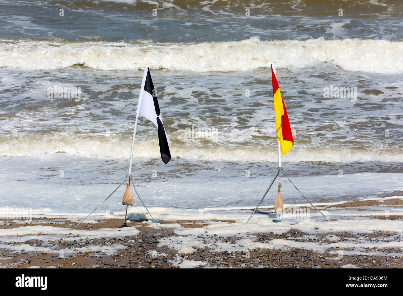 Warning flags for surfers indicating where the sea is safe Stock Photo ...