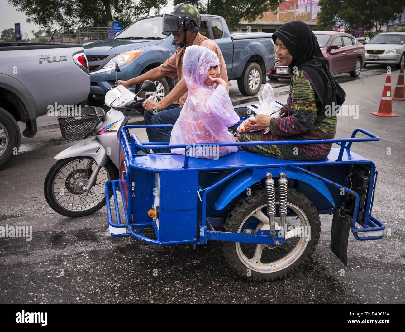 Pattani, Pattani, Thailand. 8th July, 2013. A Muslim family leaves a ...