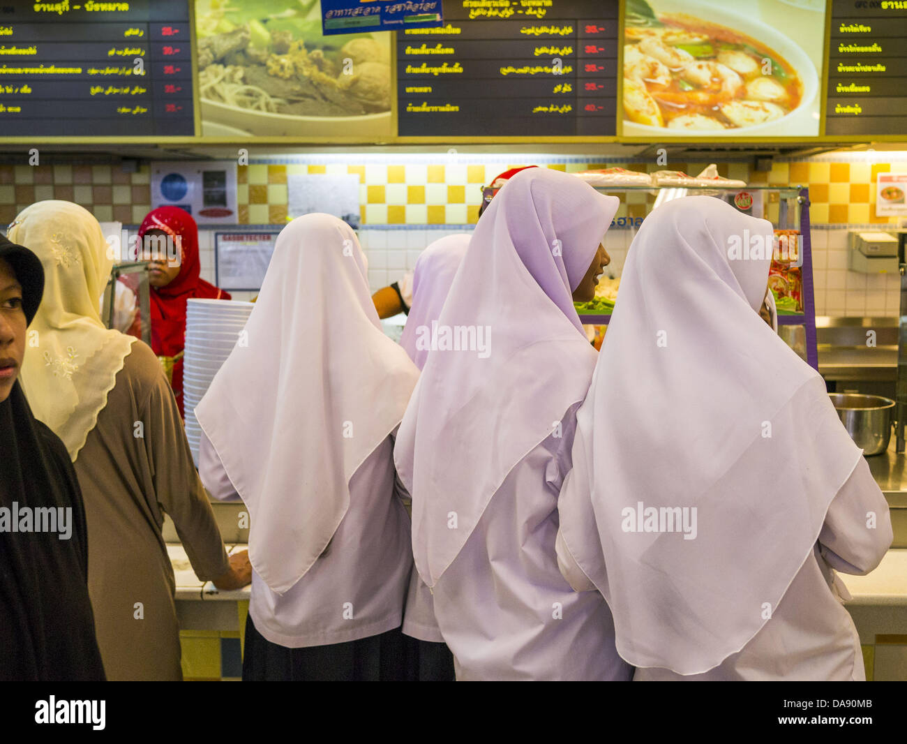 Pattani, Pattani, Thailand. 8th July, 2013. Muslim school girls look at ...