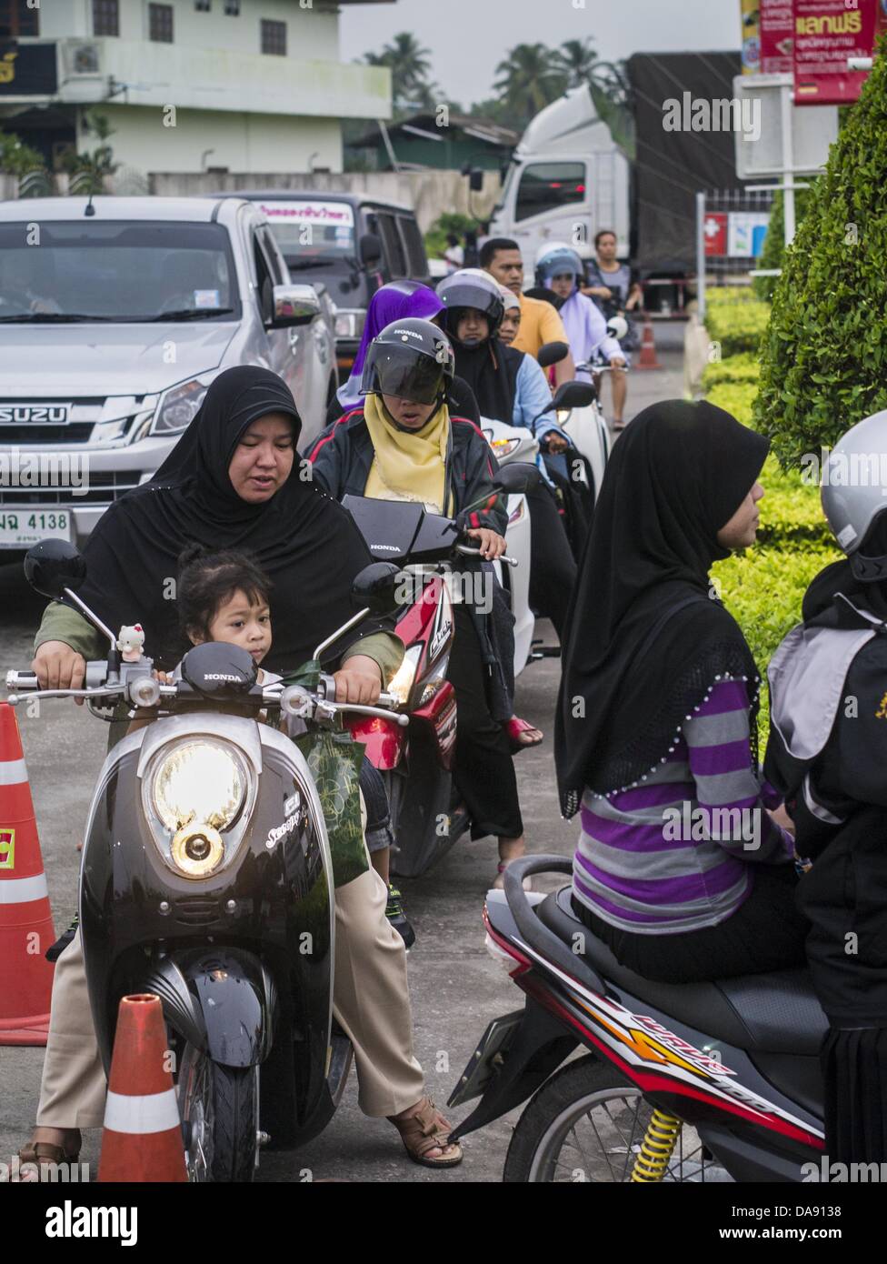 Pattani, Pattani, Thailand. 8th July, 2013. Muslim women on motorcycles ...